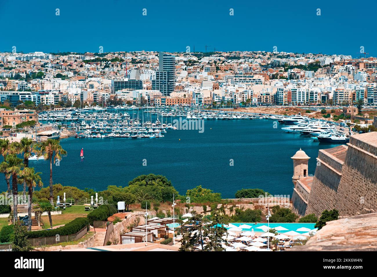 An aerial shot of a port surrounded by hundreds of modern buildings in ...