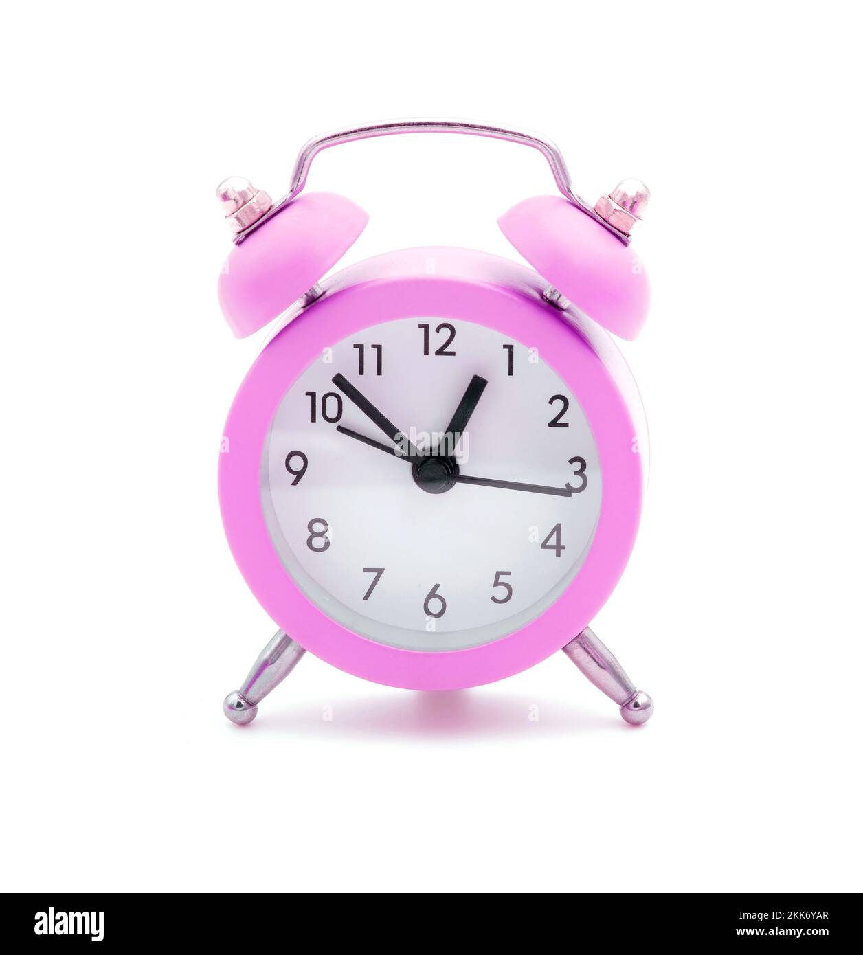 Classic pink table clock on a white background Stock Photo - Alamy