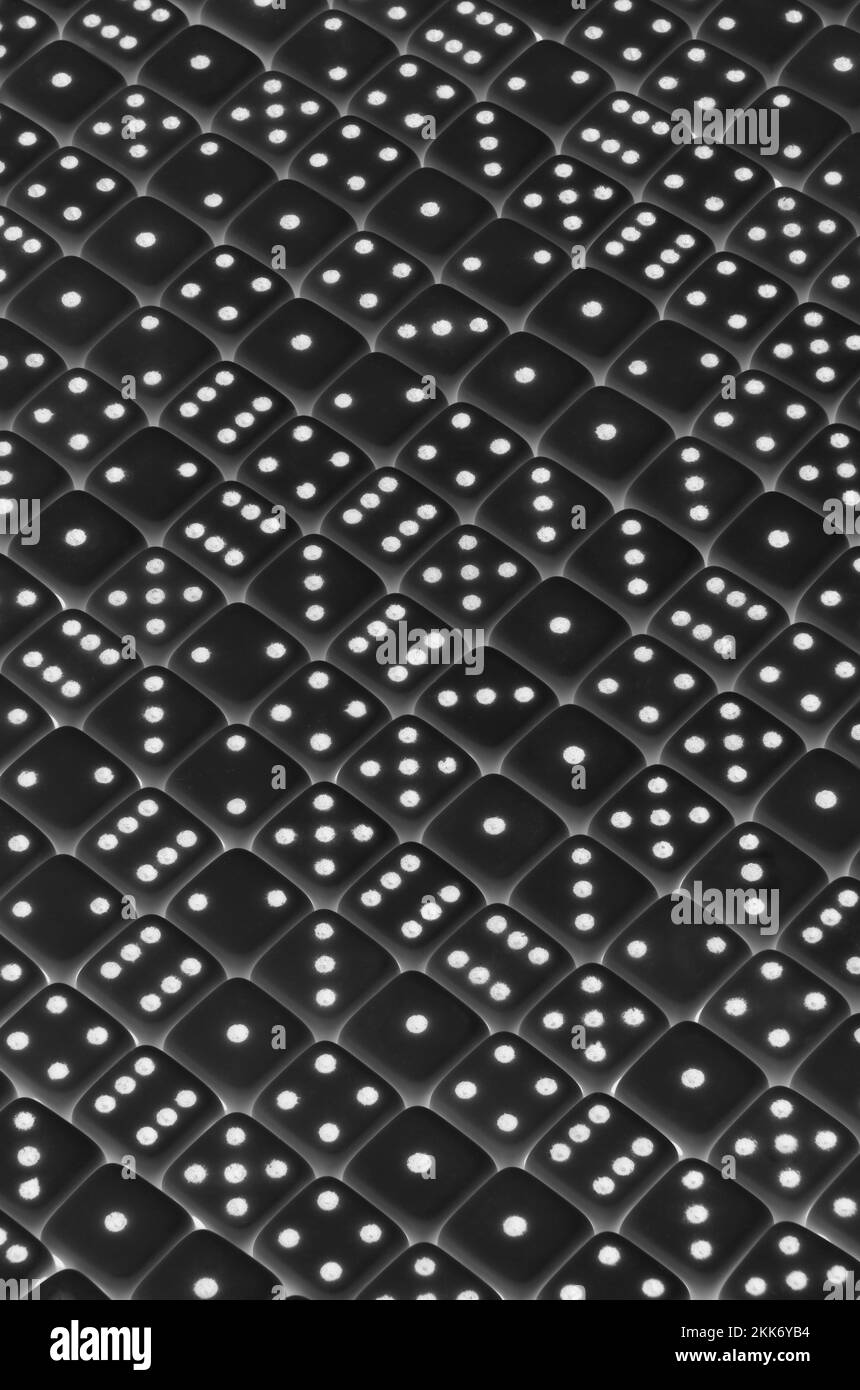 black dice with white dots background Stock Photo - Alamy