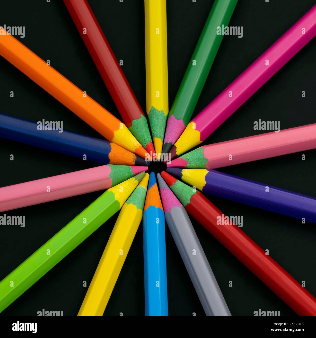 coloring wooden pencil in a circle on balck background Stock Photo - Alamy