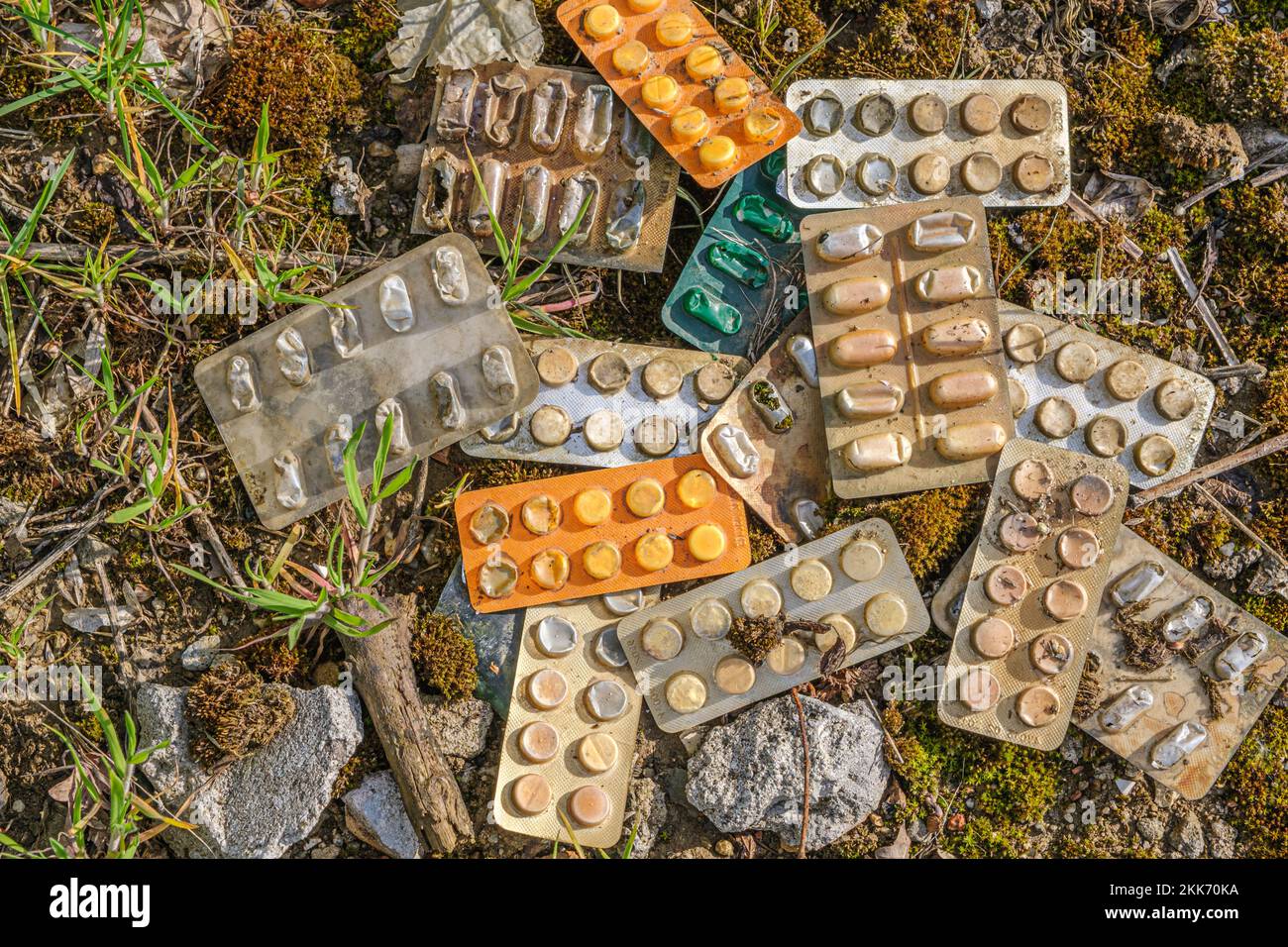 Different medicines: tablets discarded in nature Stock Photo - Alamy