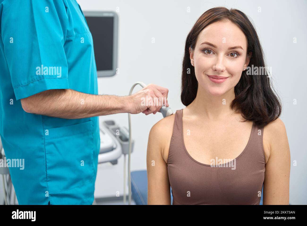 Woman undergoing an ultrasound examination of the upper body Stock ...