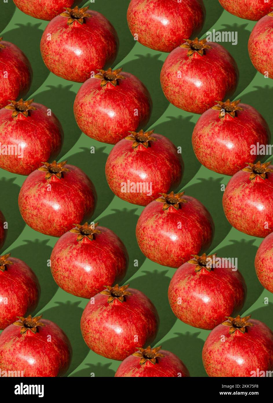 Pomegranate pattern. Red pomegranates on a green background. Fruit food ...