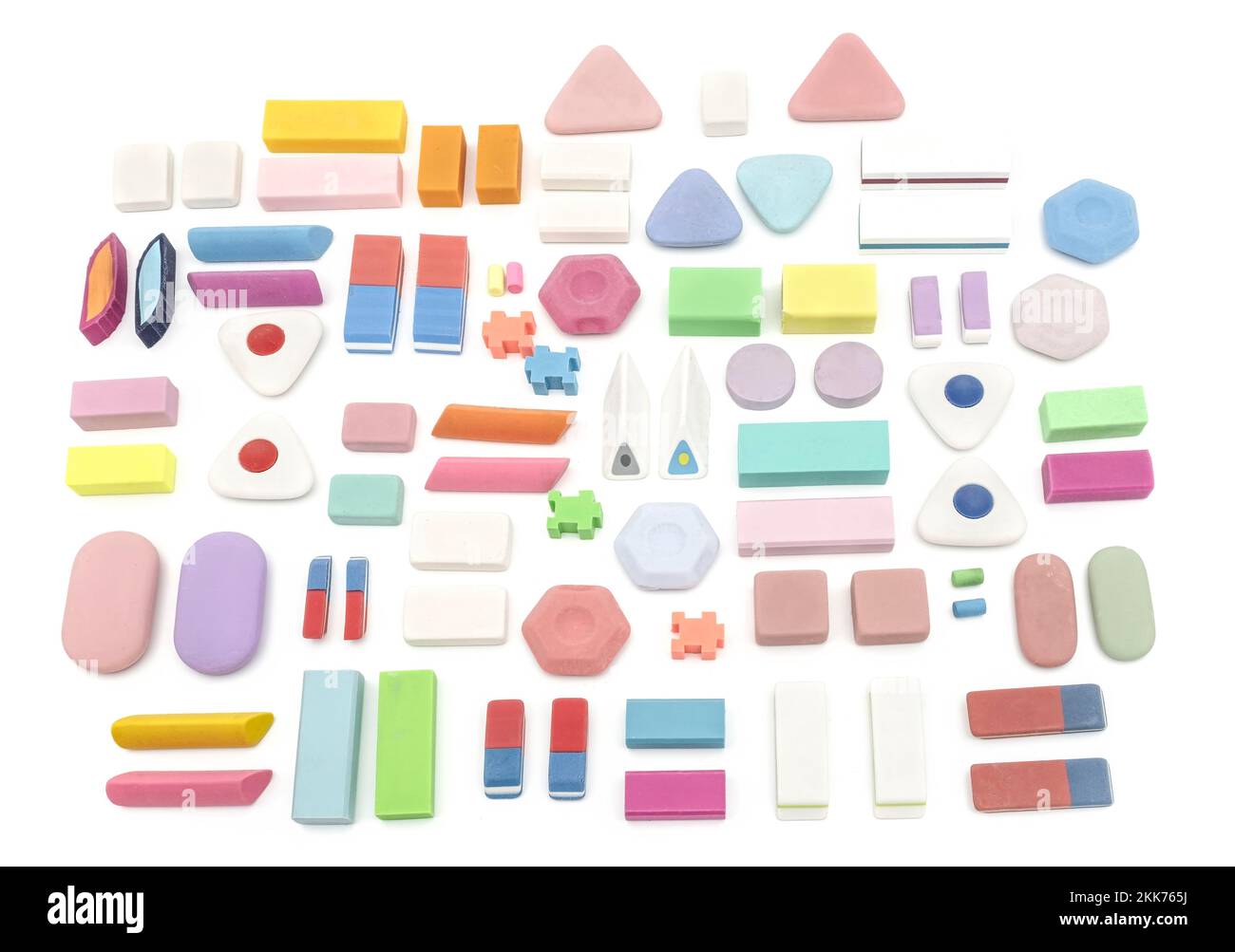 various shapes and colors of erasers arranged isolated on white ...
