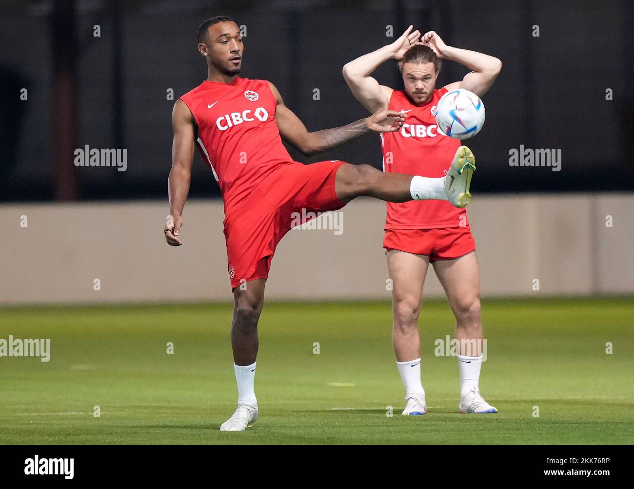 November 25, 2022, DOHA, QATAR: Canada defender Derek Cornelius, left ...