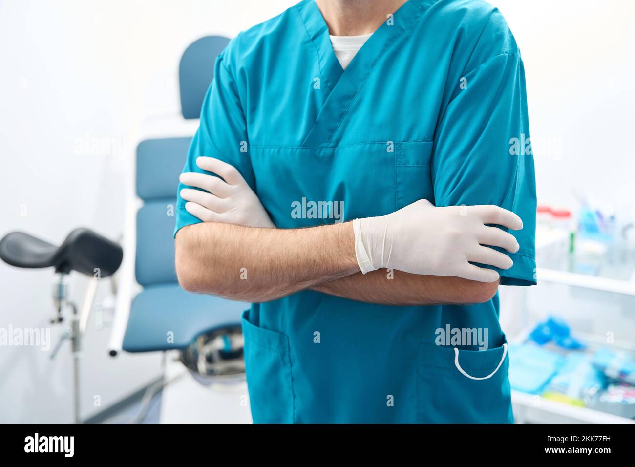 Gynecologist stands in middle of medical office in sterile gloves Stock ...