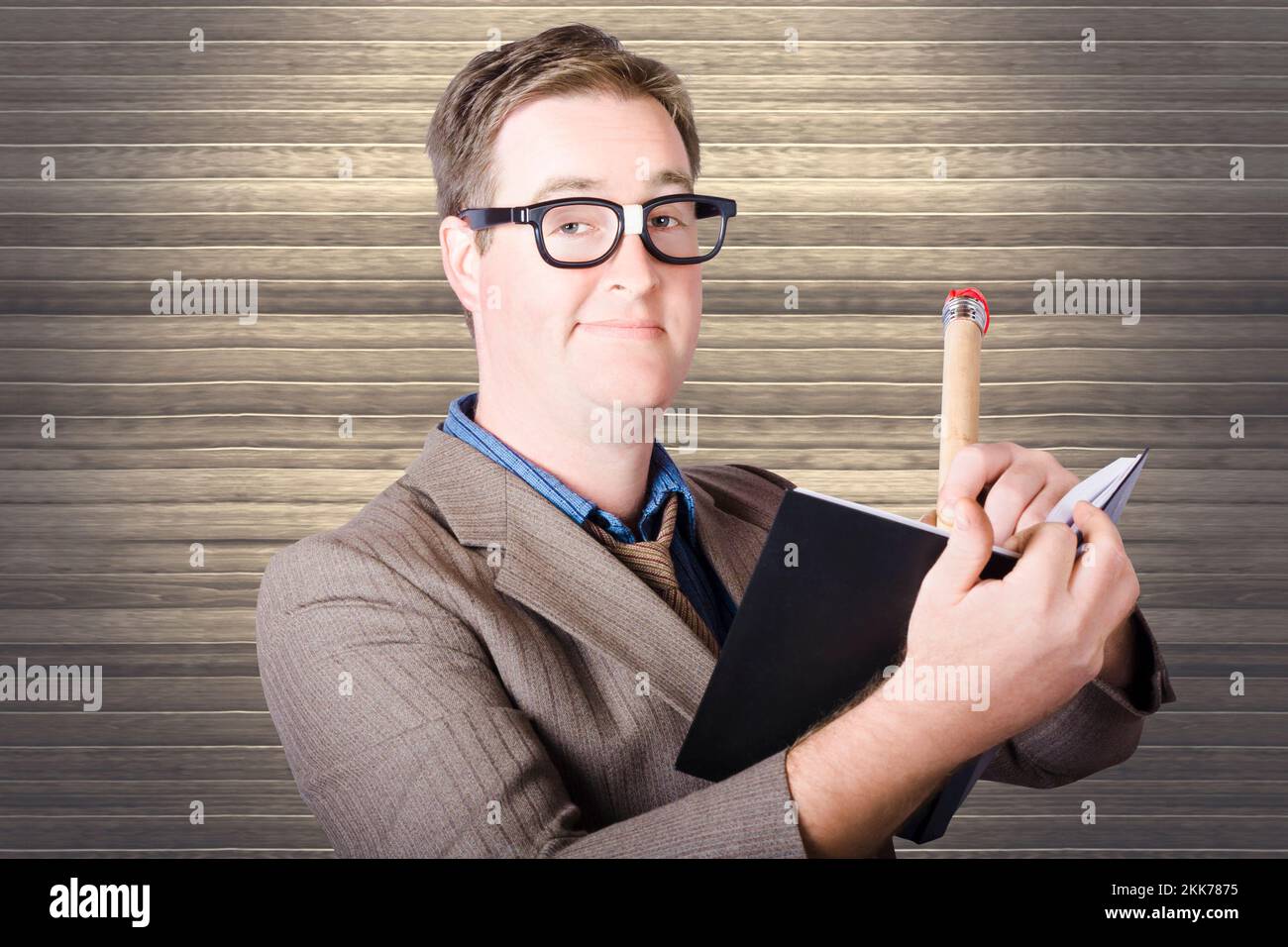 Funny nerd businessman minuting massive business plan when writing with ...