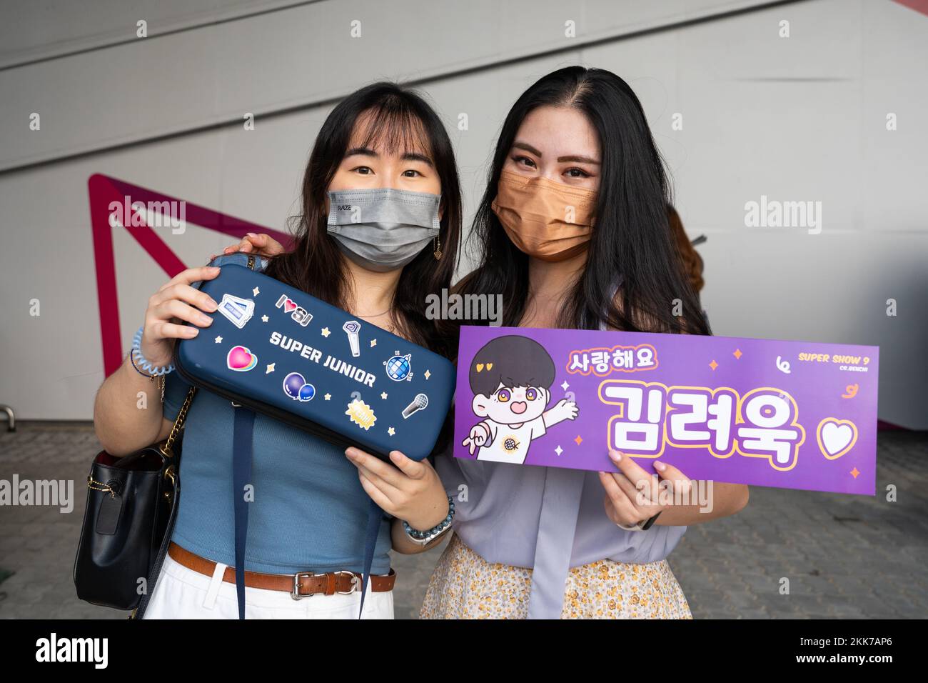 Hong Kong residents Irene (right) and Yammi Poon (Left) holding fan ...