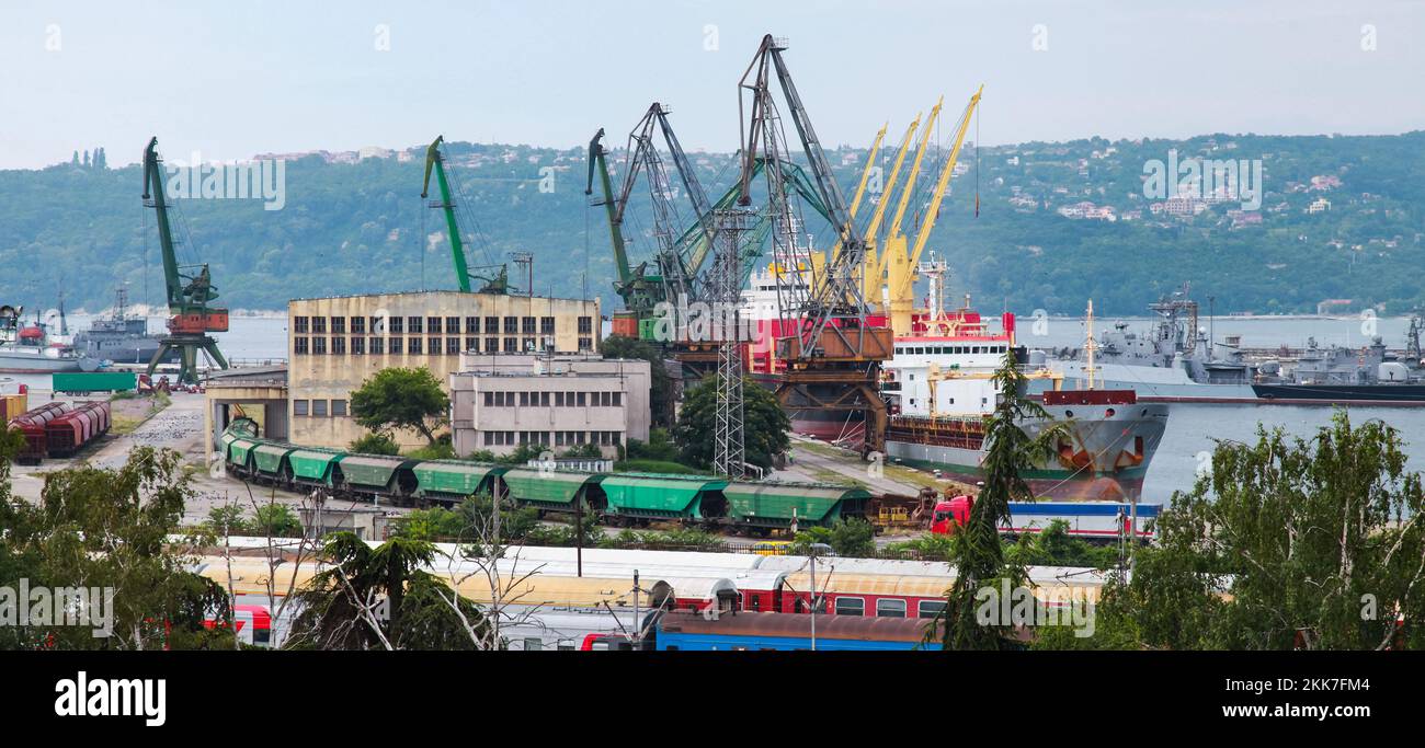 Port cranes, cargo ships and industrial buildings, summer view of Varna ...