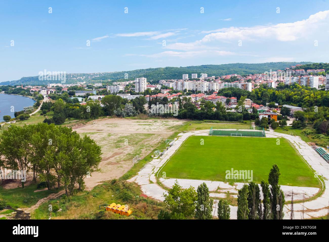 Landscape photo with an empty soccer field, coastal view on a summer ...