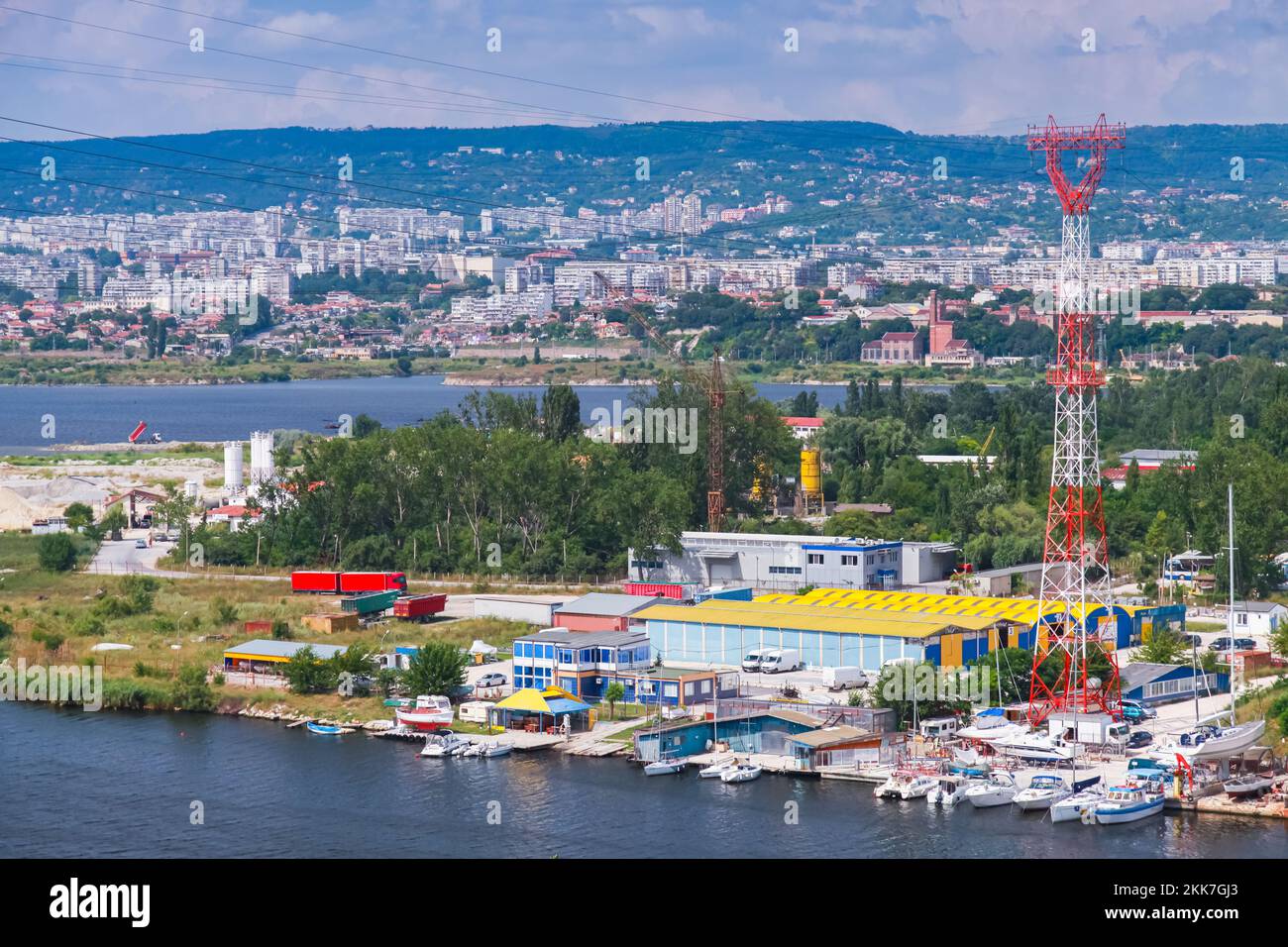 Varna lake coast with high-voltage power line truss pole. Landscape ...