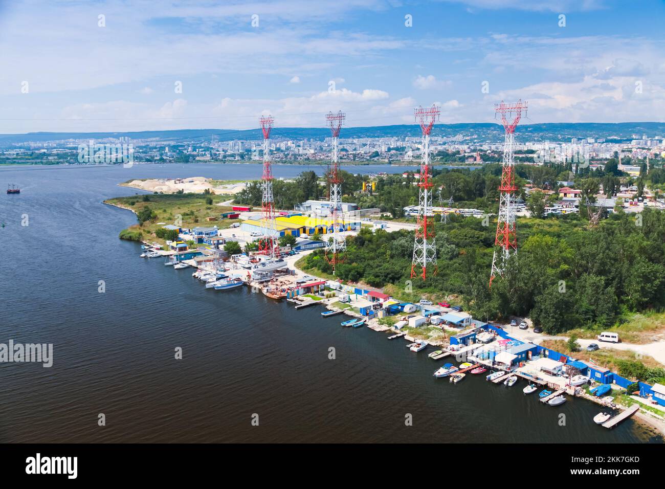 High-voltage power line truss poles mounted on the Varna lake shore ...