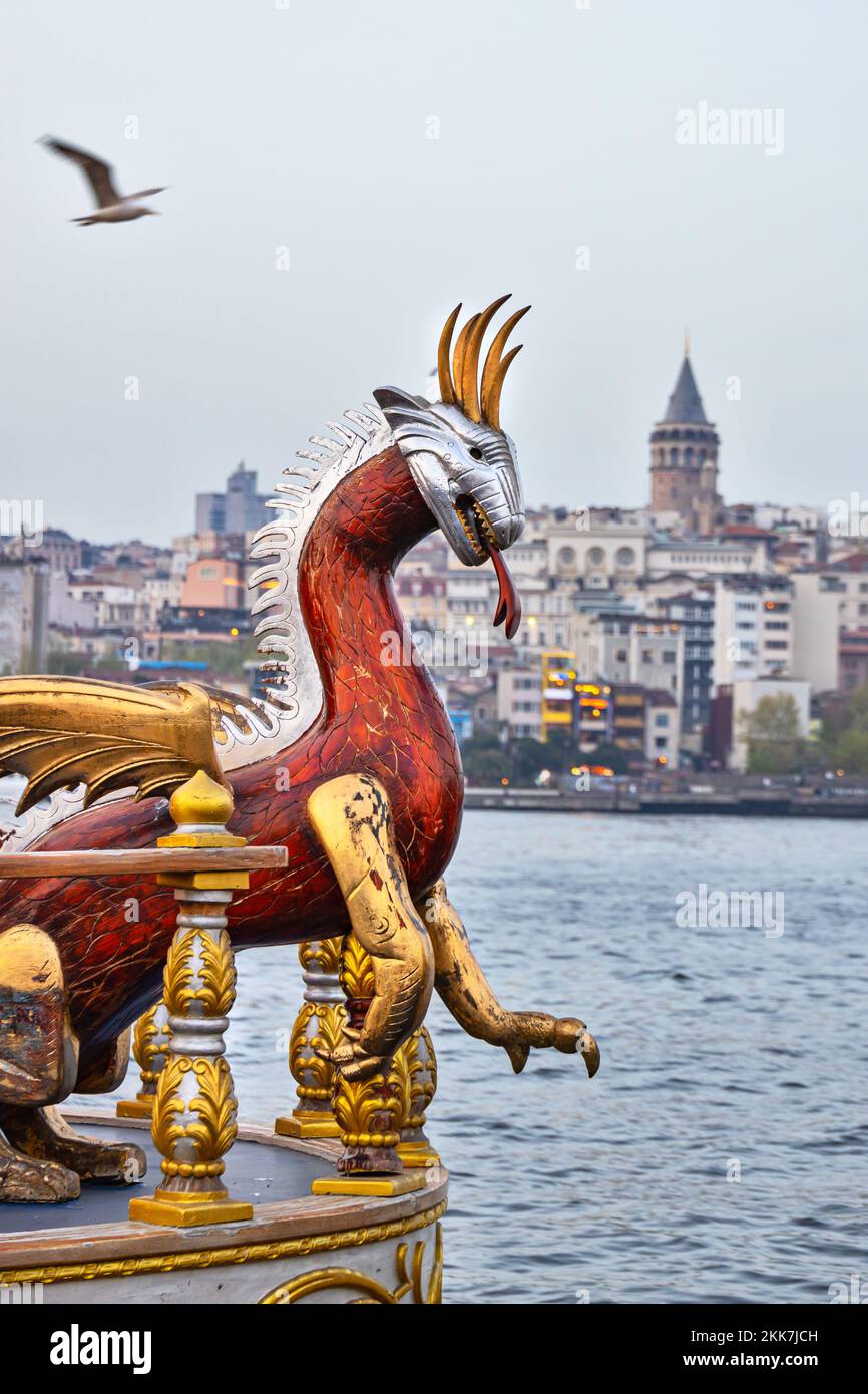 Colorful wooden dragon on a ship docked in Galata region of Istanbul ...
