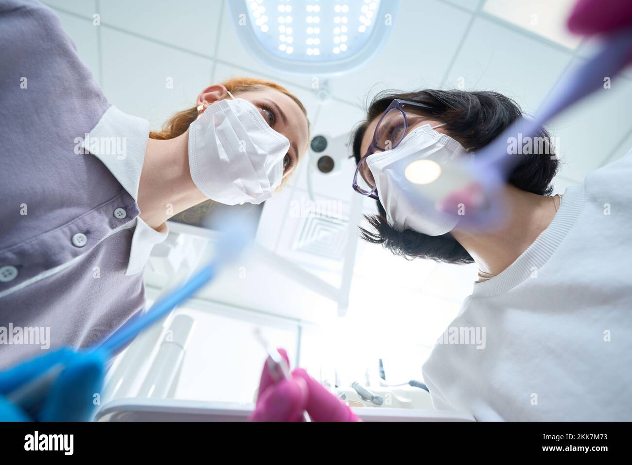 Two medical workers in the process of dental manipulation Stock Photo ...