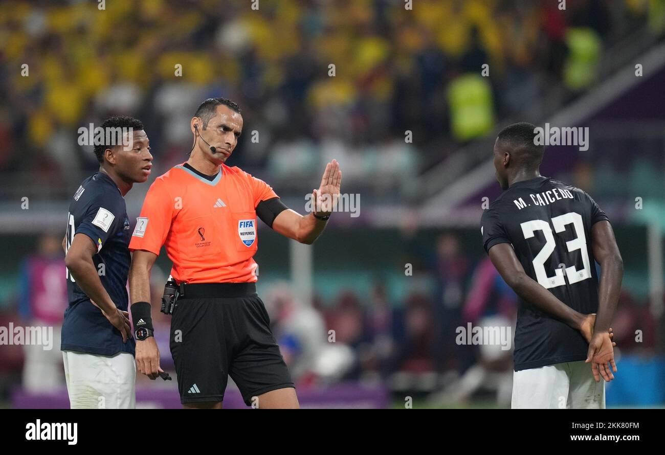 Doha, Qatar. 25th Nov, 2022. Moises Caicedo (R) of Ecuador appeals to ...
