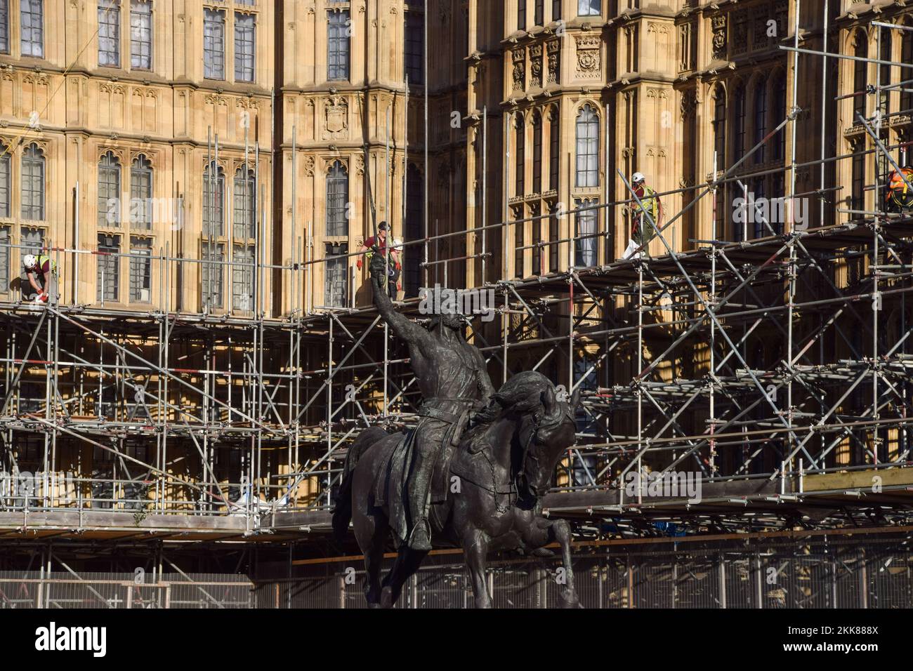 Workers remove the scaffolding from parts of the Palace of Westminster ...