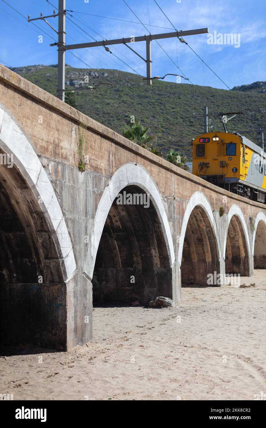 Train on bridge with Mountain in background in Kalk Bay Cape Town South ...