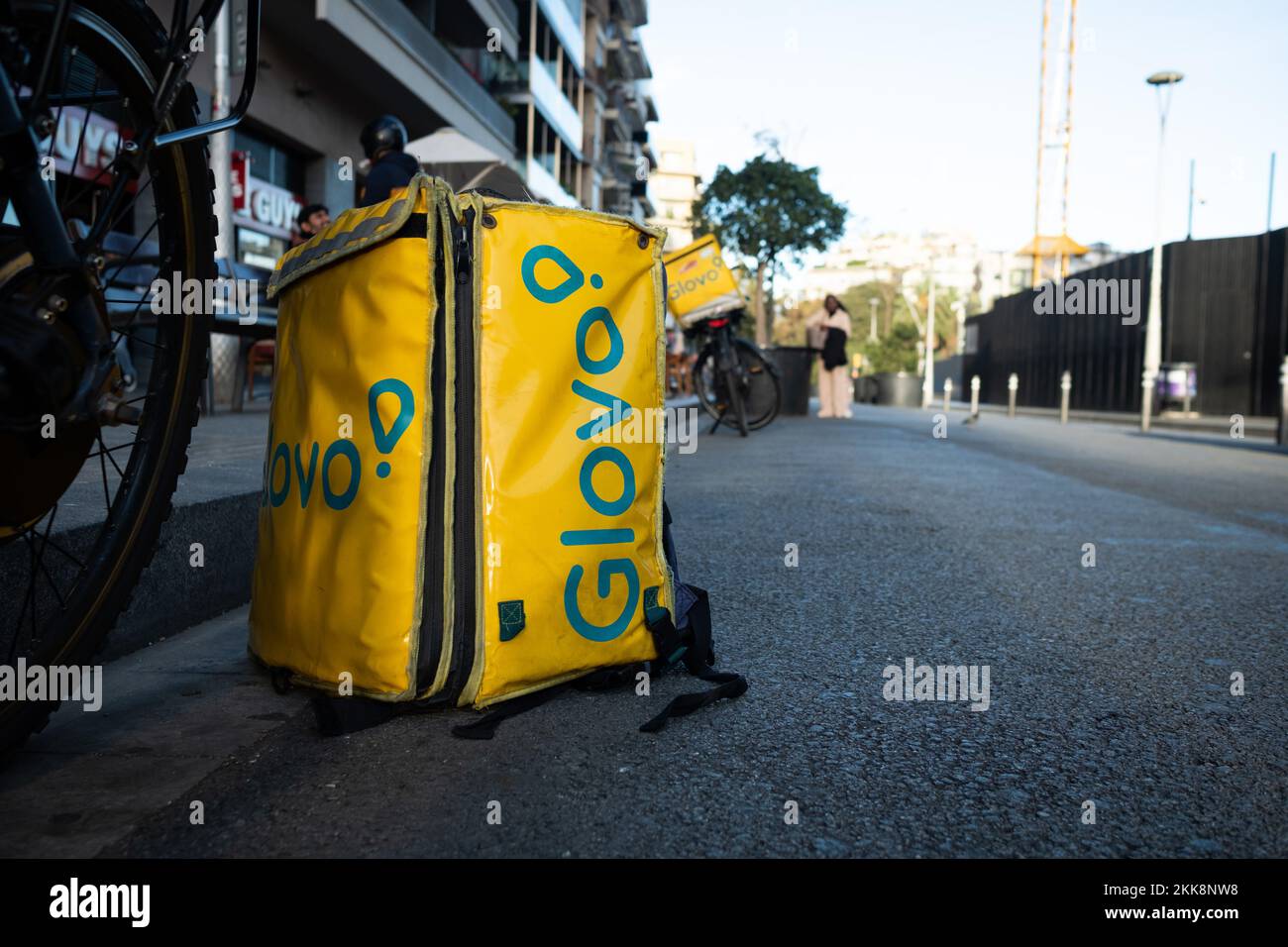 A close up view of a yellow bag with the Spanish start-up delivery company Glovo logo on the ...