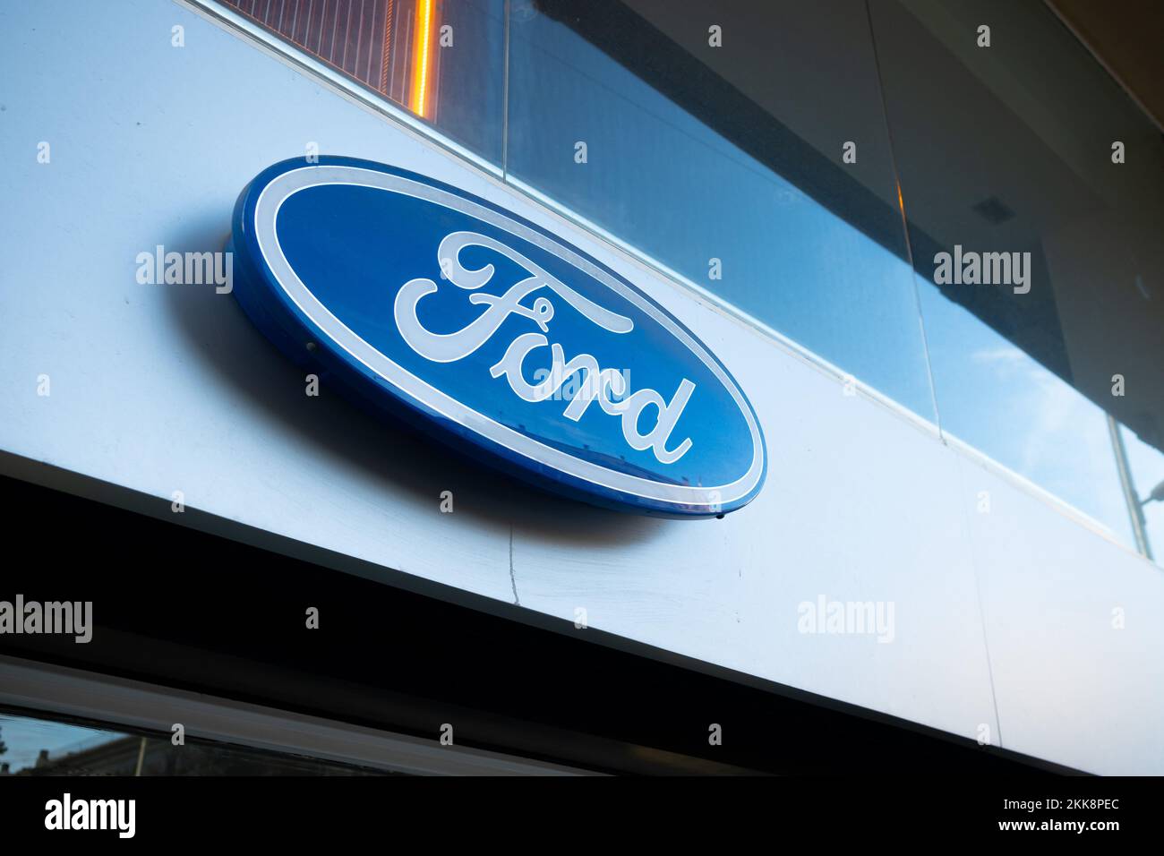 The logo of the American automotive company Ford is seen on top of a ...