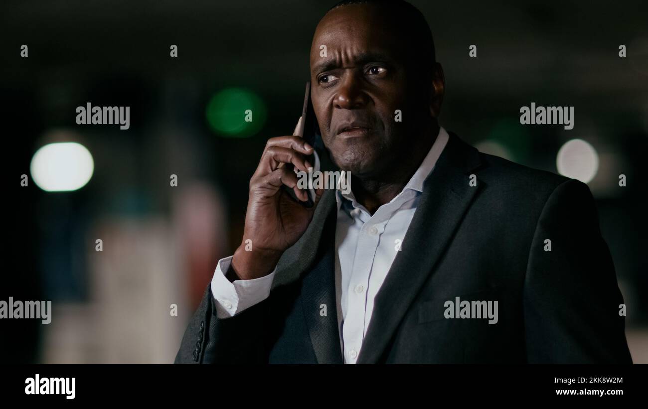 Serious puzzled excited emotional man talking on mobile phone adult ...