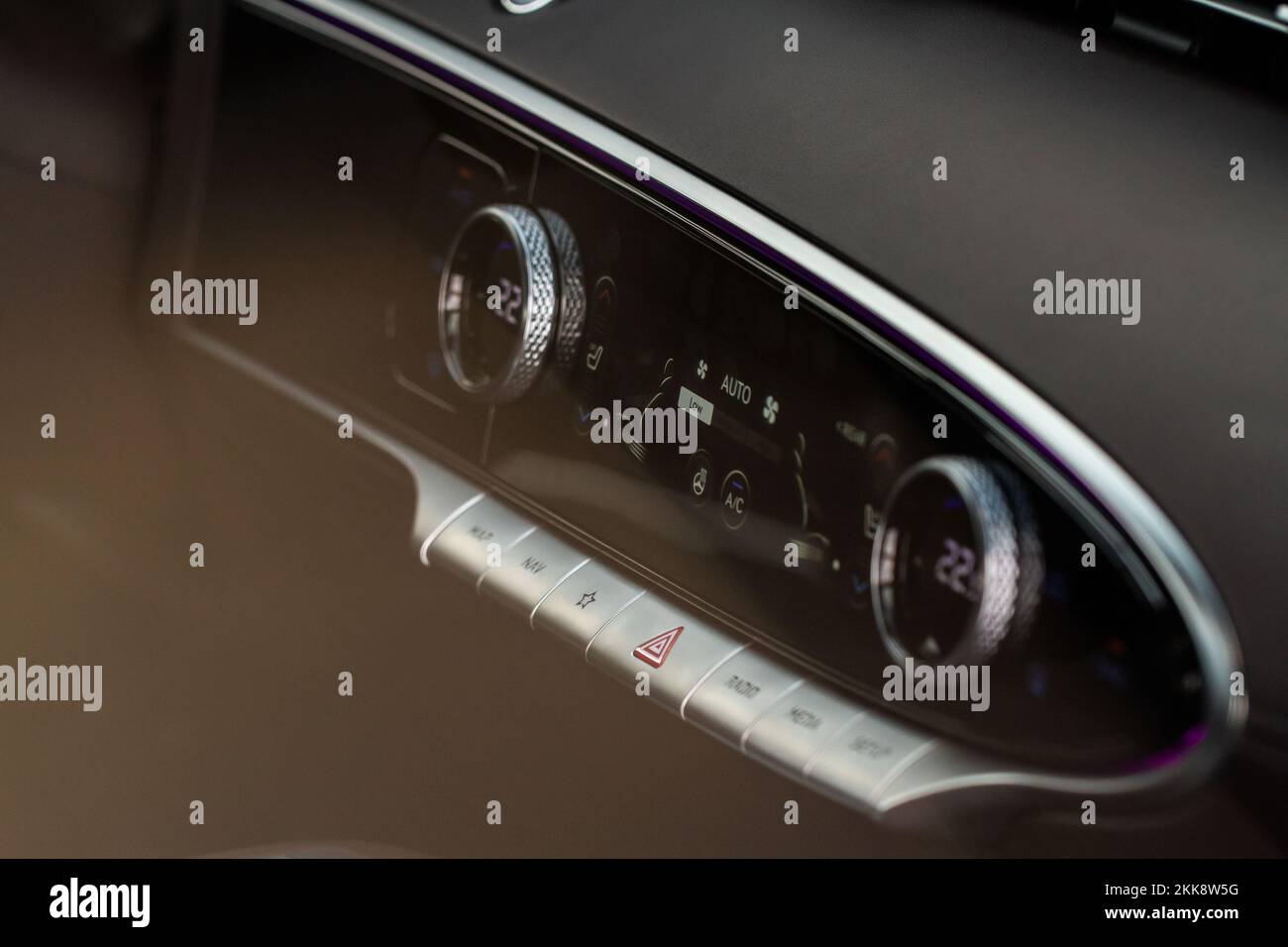 Red triangle hazard light button on car dashboard. Car media buttons ...