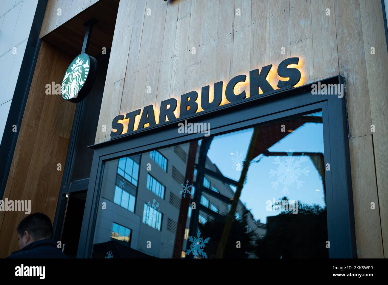 The logo of the coffee shop chain Starbucks is seen on a sign on top of ...