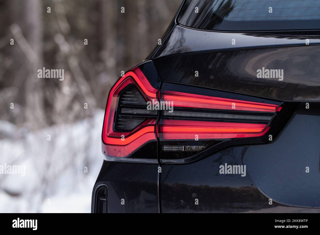 Modern rear light of a car. Brake light and arrow of large suv. Rear ...