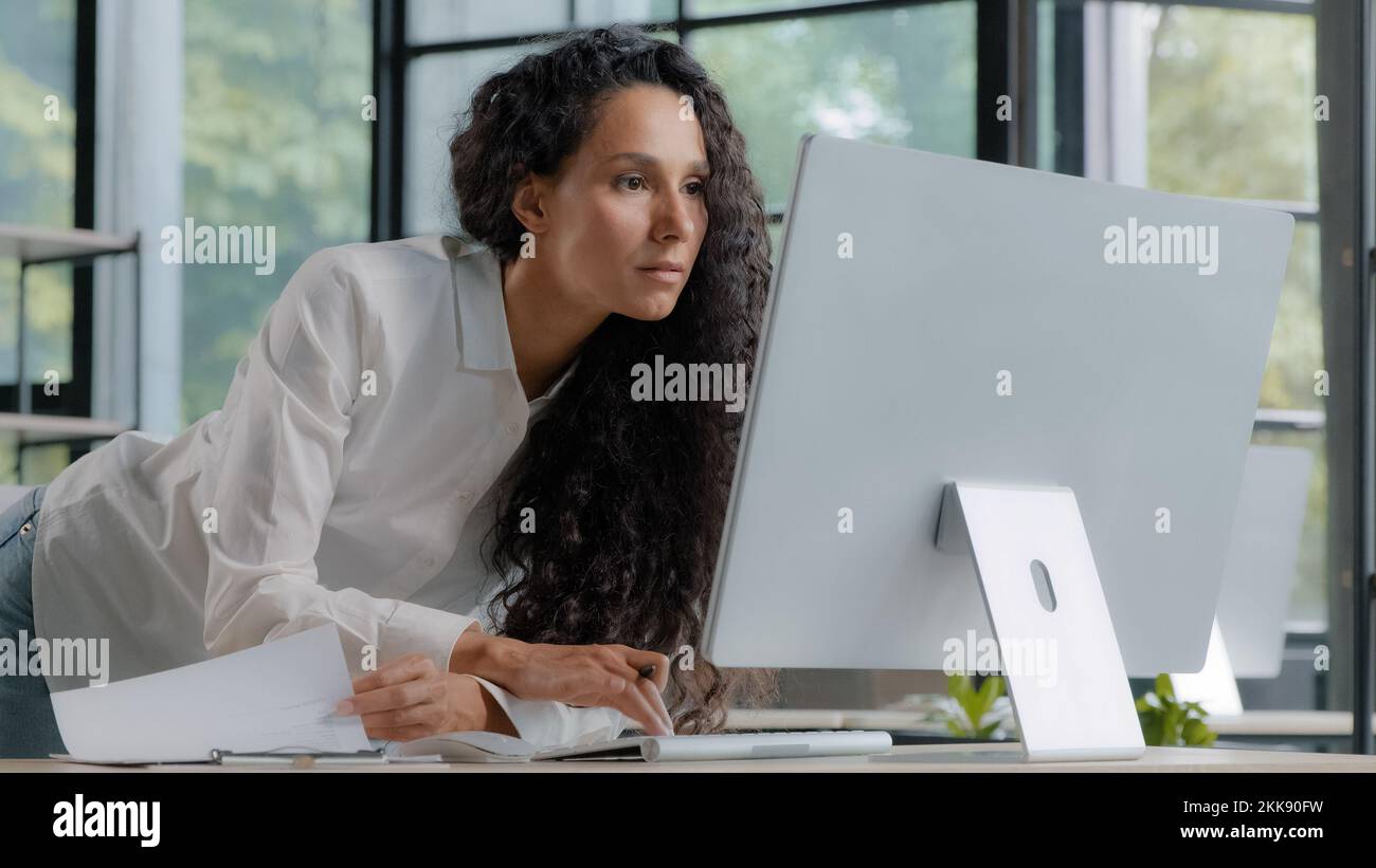 Young attractive hispanic woman professional manager developer working ...