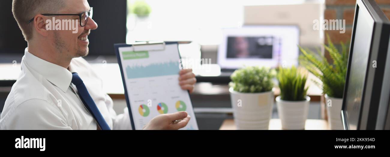 Businessman presenting financial report online to colleague, clever ...