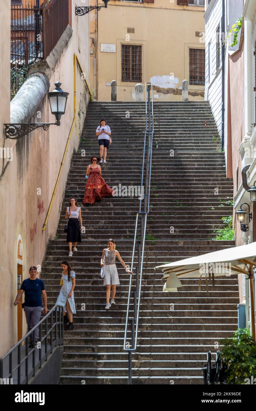 Rome, Italy - August 5, 2021: people at steps at small Via di Monte ...