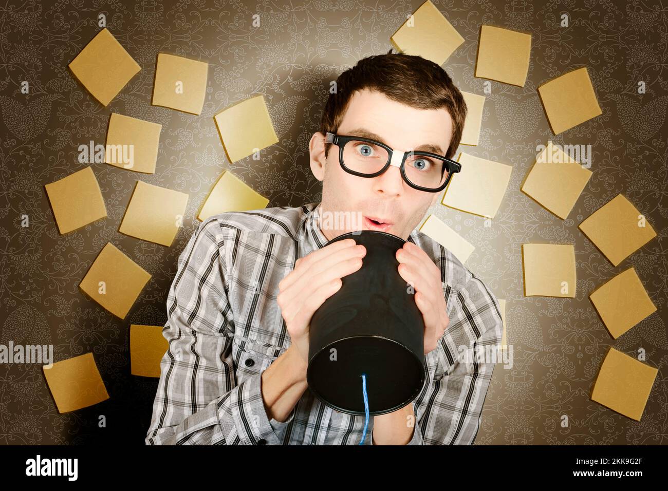 Office admin geek calling out a memo to workers on bulletin board ...