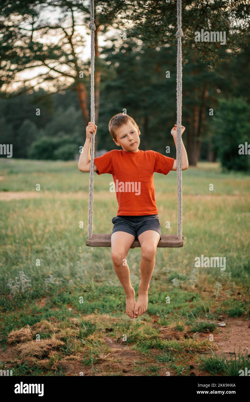Park playground swinging barefoot hi-res stock photography and images ...