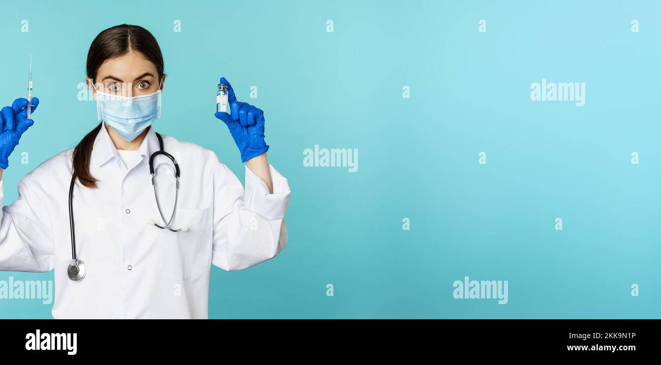 Smiling medical staff, doctor in face mask and rubber gloves, showing ...