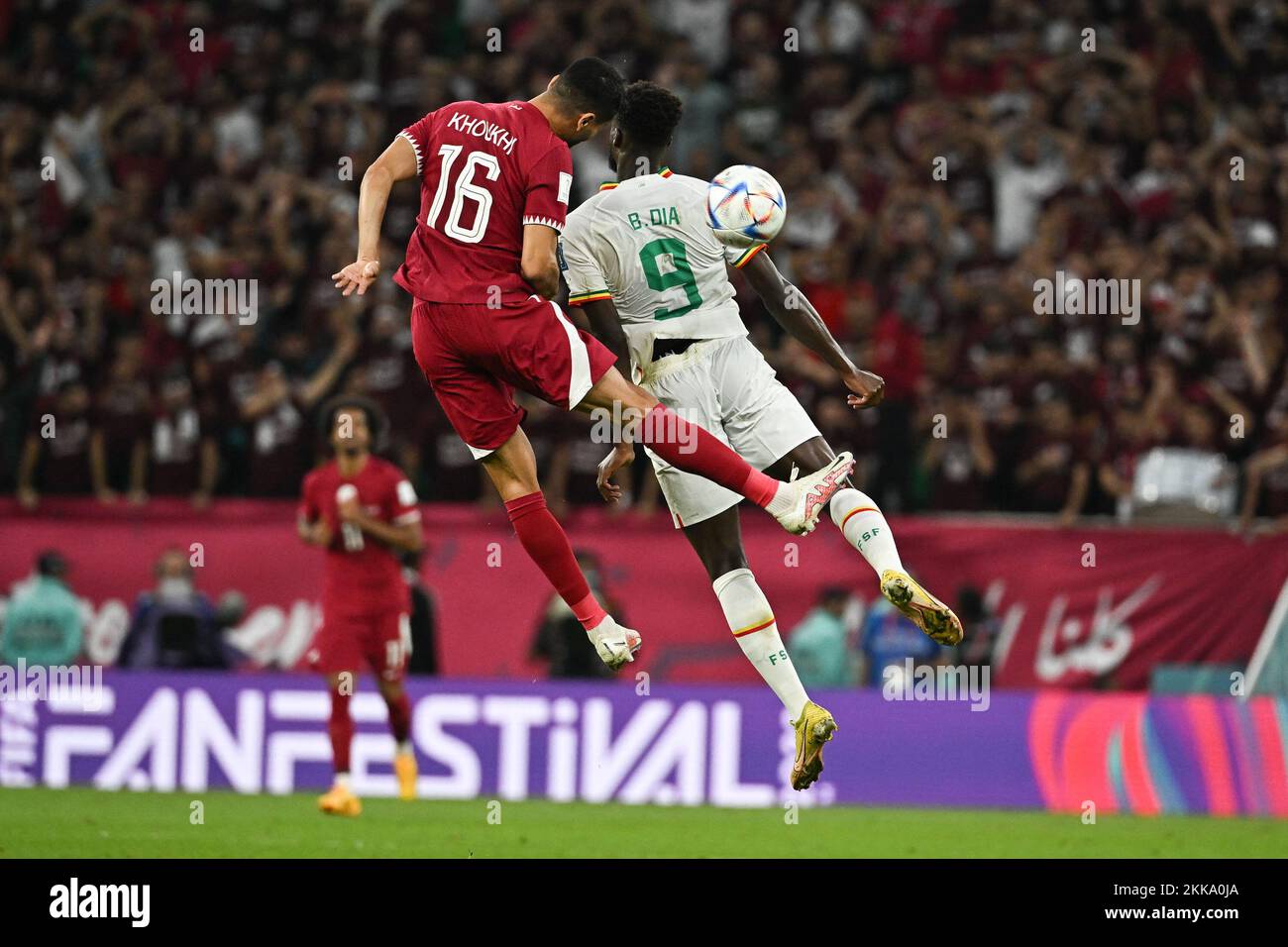 Khalid Muneer of Qatar Iliman Ndiaye of Senegal during Qatar v Senegal ...