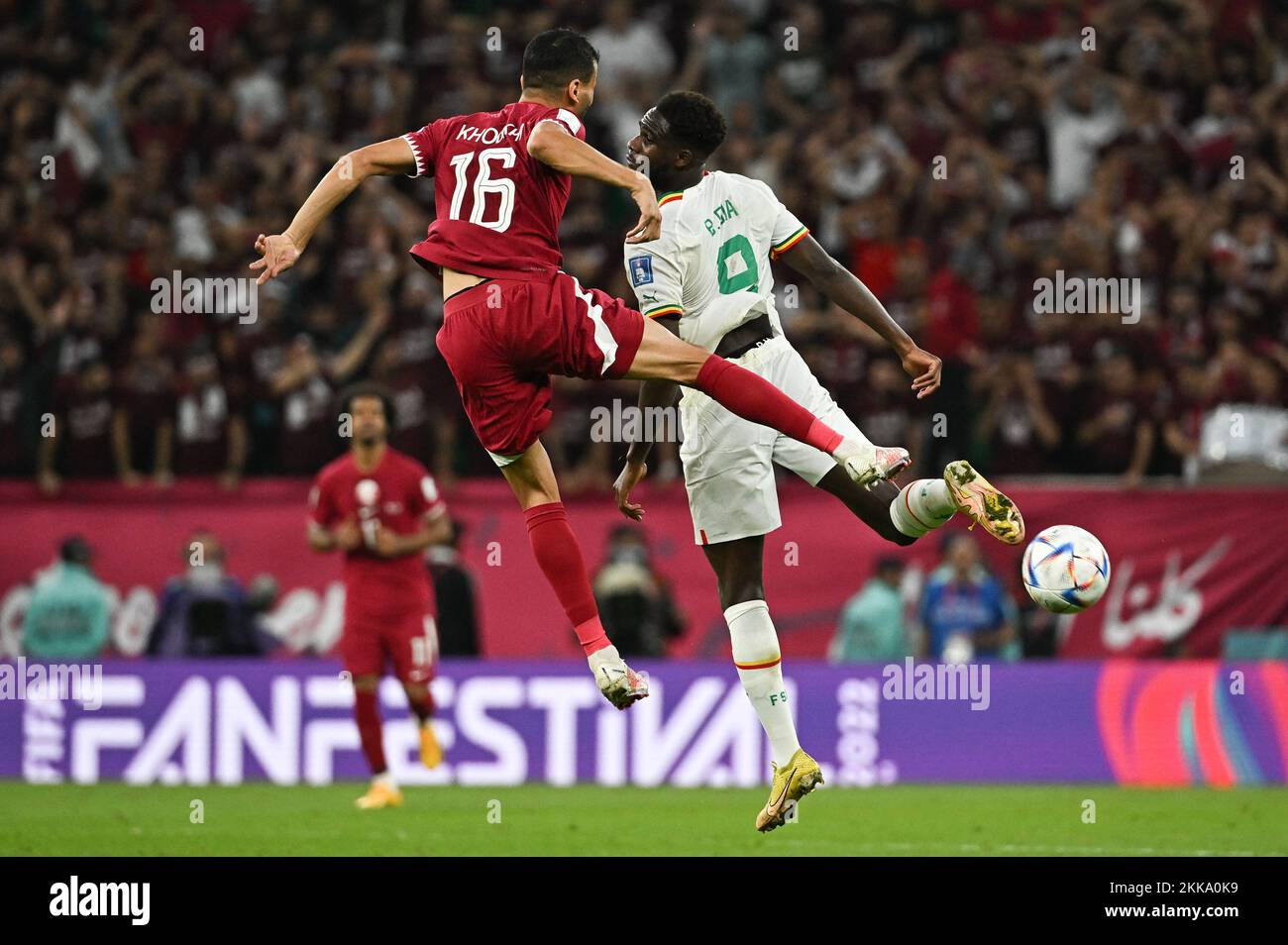 Khalid Muneer of Qatar Iliman Ndiaye of Senegal during Qatar v Senegal ...
