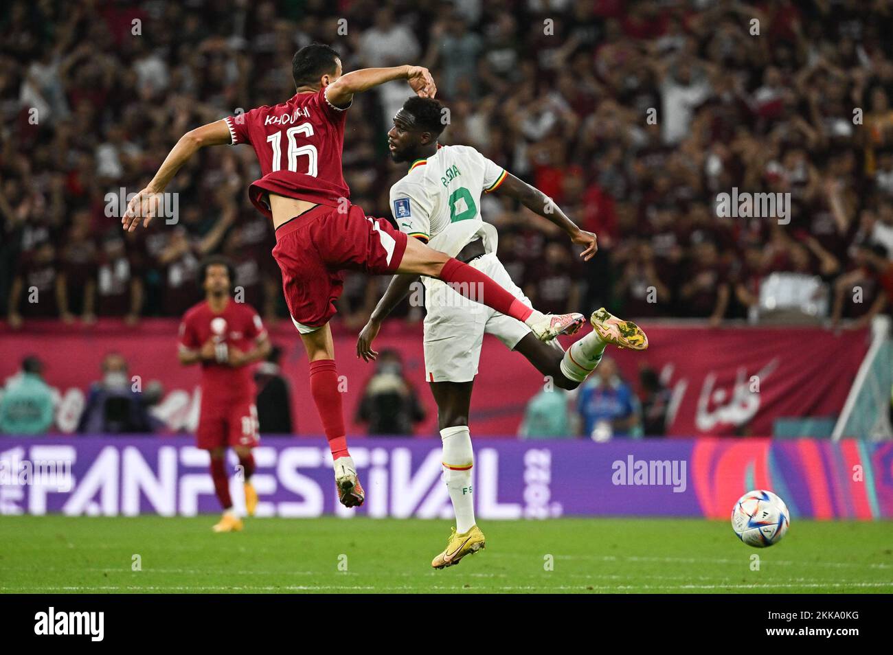 Khalid Muneer of Qatar Iliman Ndiaye of Senegal during Qatar v Senegal ...