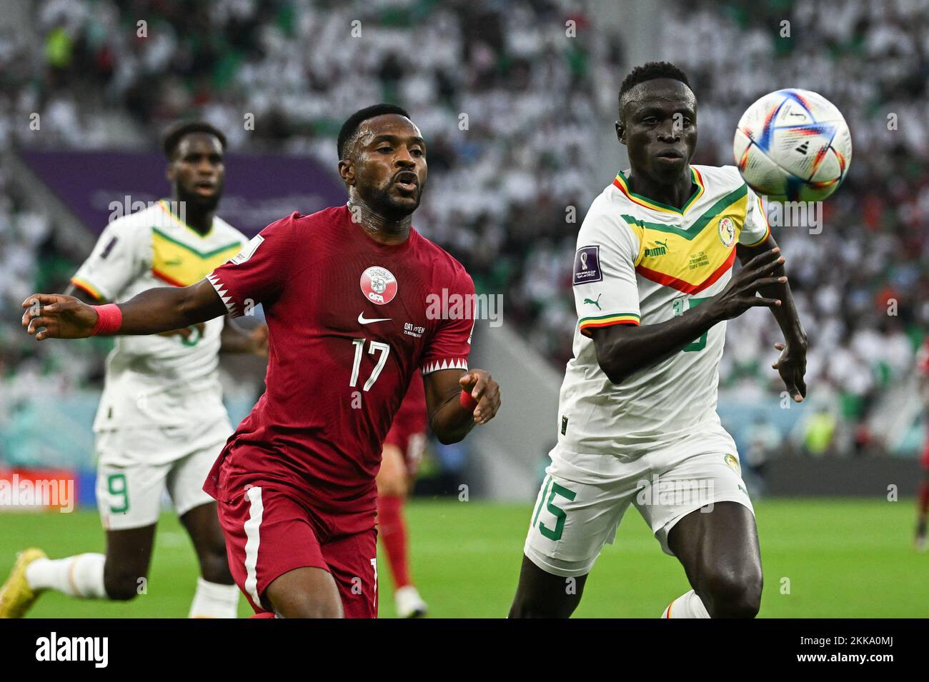Ismaeel Mohammad of Qatar and Krepin Diatta of Senegal during Qatar v ...