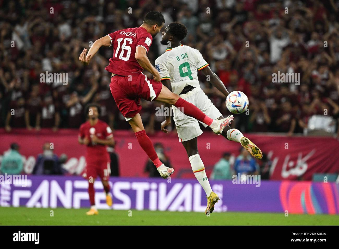 Khalid Muneer of Qatar Iliman Ndiaye of Senegal during Qatar v Senegal ...