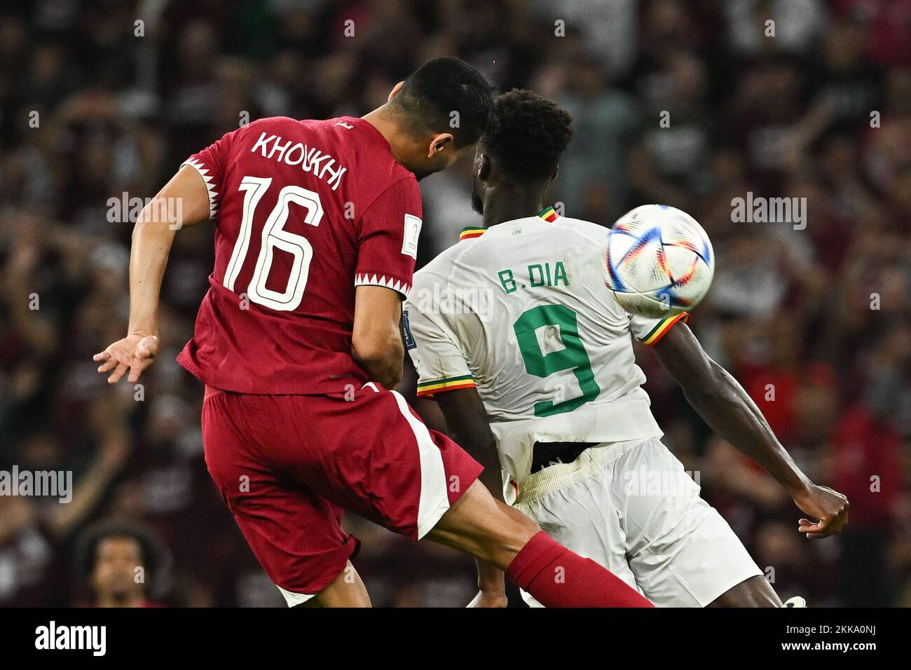 Khalid Muneer of Qatar Iliman Ndiaye of Senegal during Qatar v Senegal ...