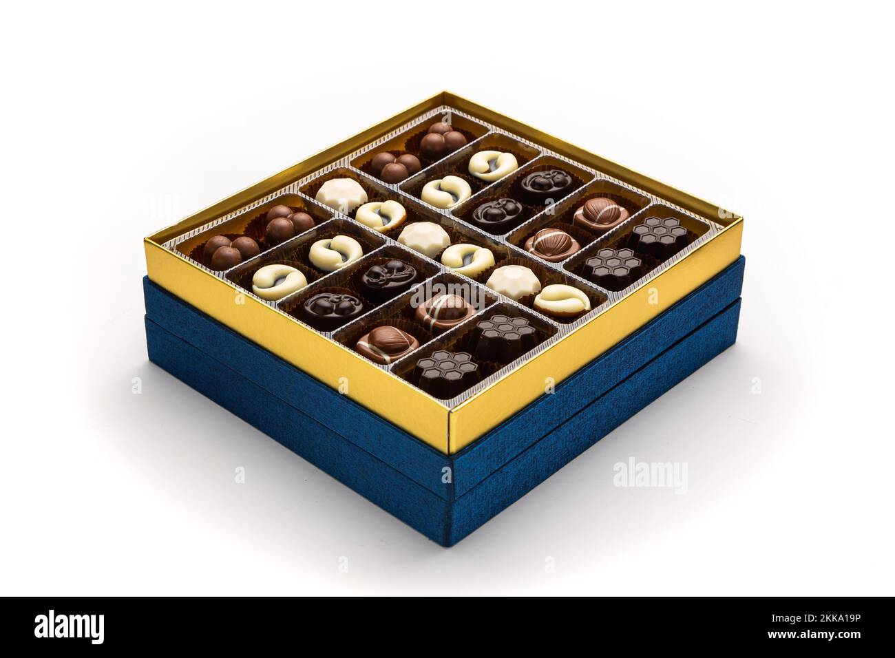 An open chocolate box isolated on white background Stock Photo - Alamy
