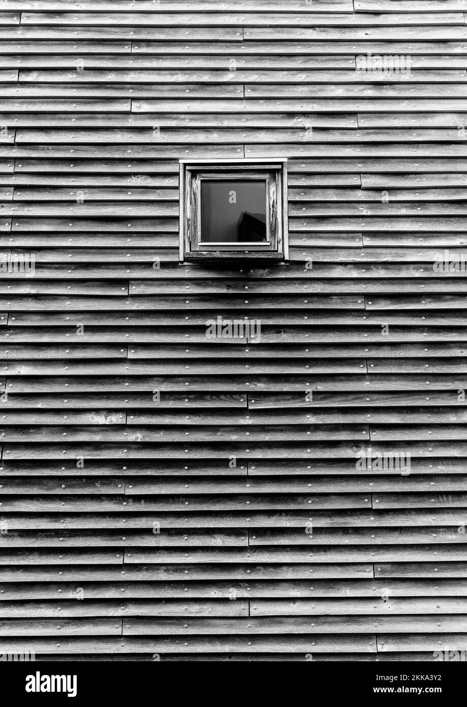 Small single square window on a modern architecture building ...