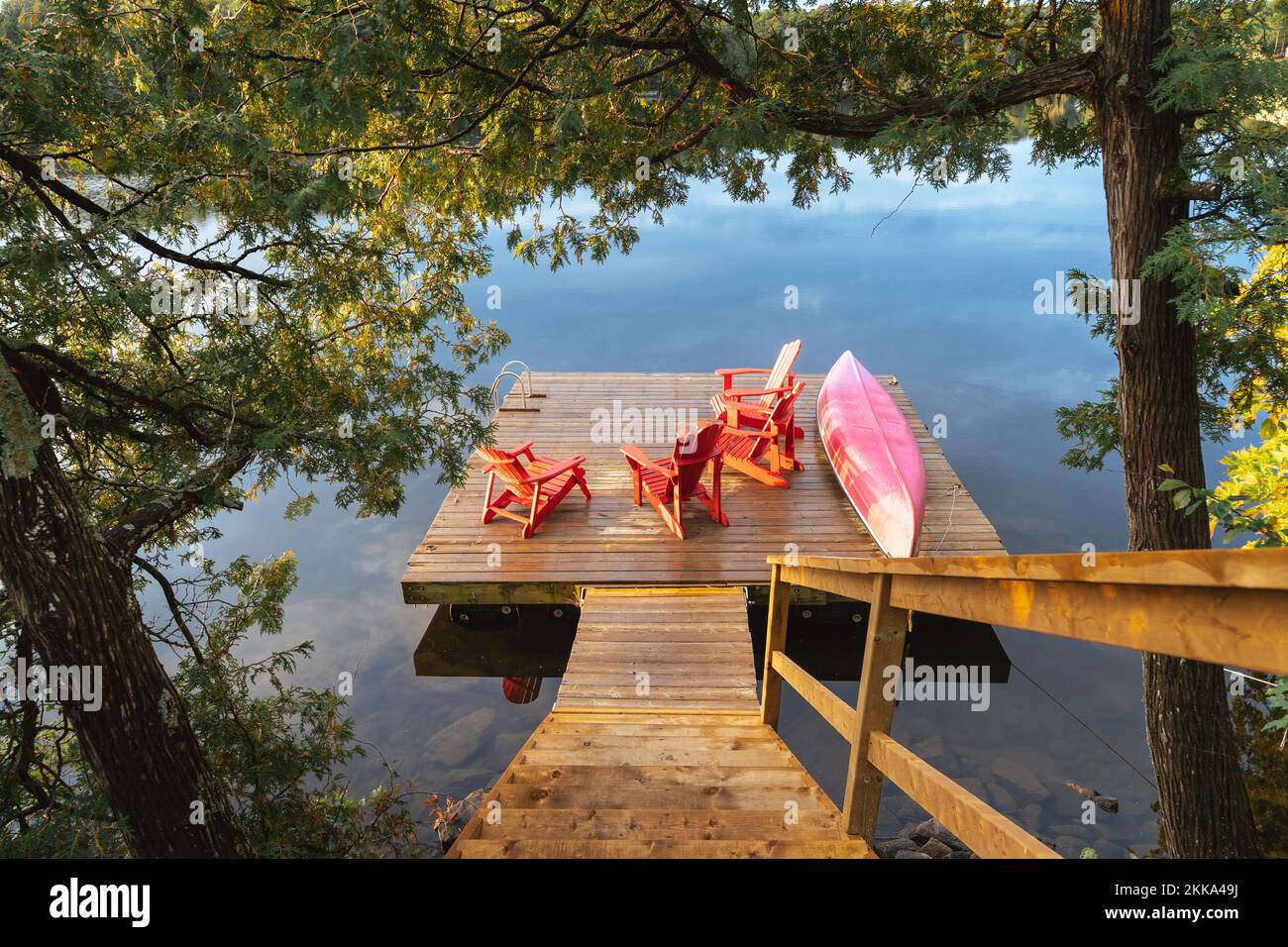 An inviting view of a dock on a calm lake Stock Photo - Alamy