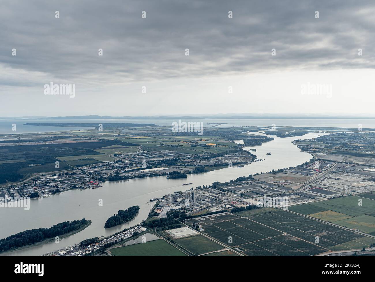 An aerial view of the Fraser River delta looking south towards ...