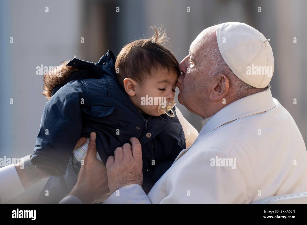 Pope Francis blesses a child during his traditional Wednesday General ...