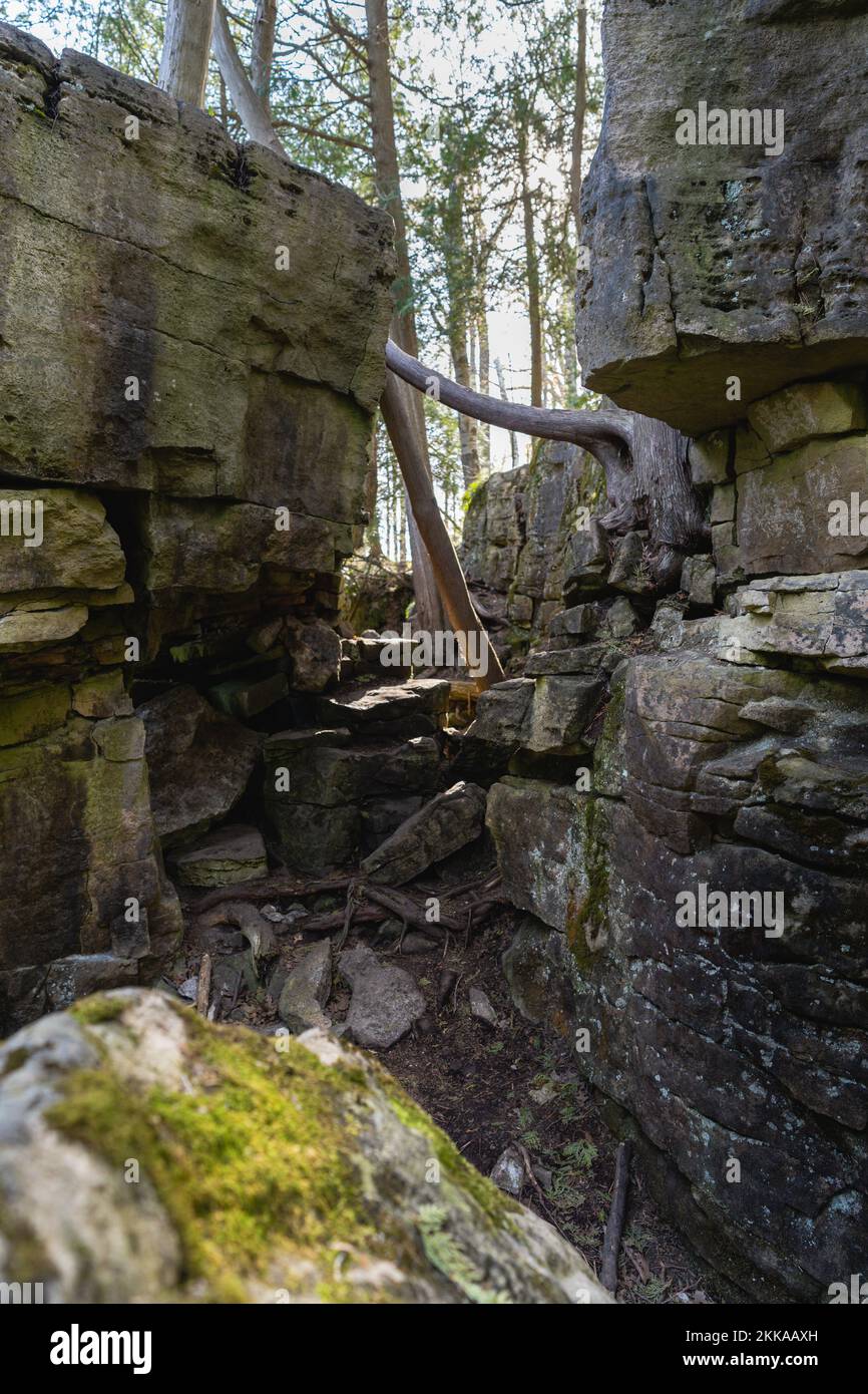 A narrow gap separates two large sections of limestone Stock Photo - Alamy