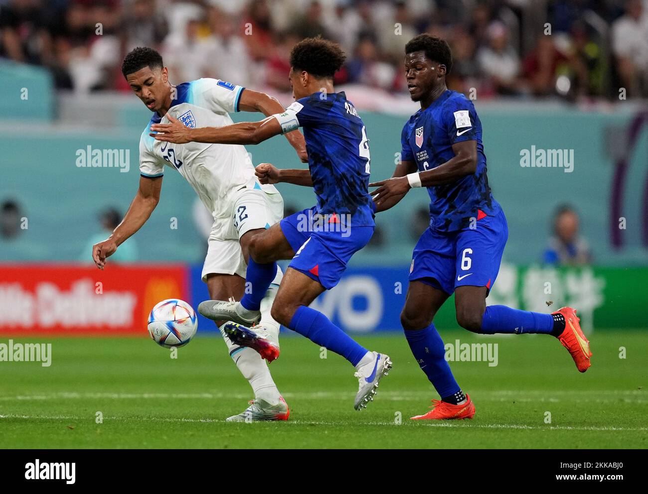 England's Jude Bellingham (left) battles with USA's Tyler Adams and ...