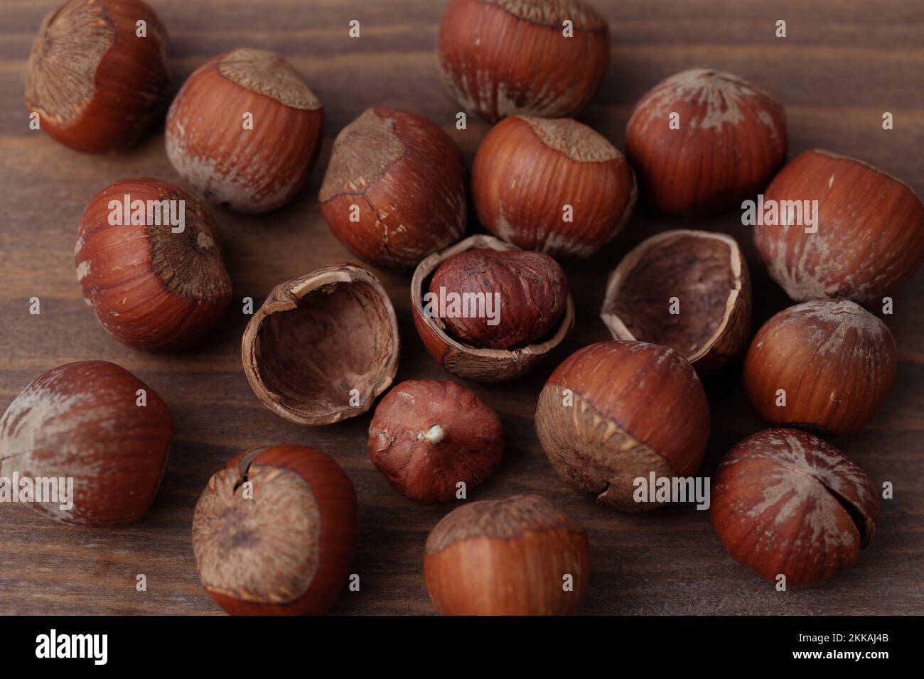 heap of hazelnuts on wooden table Stock Photo - Alamy