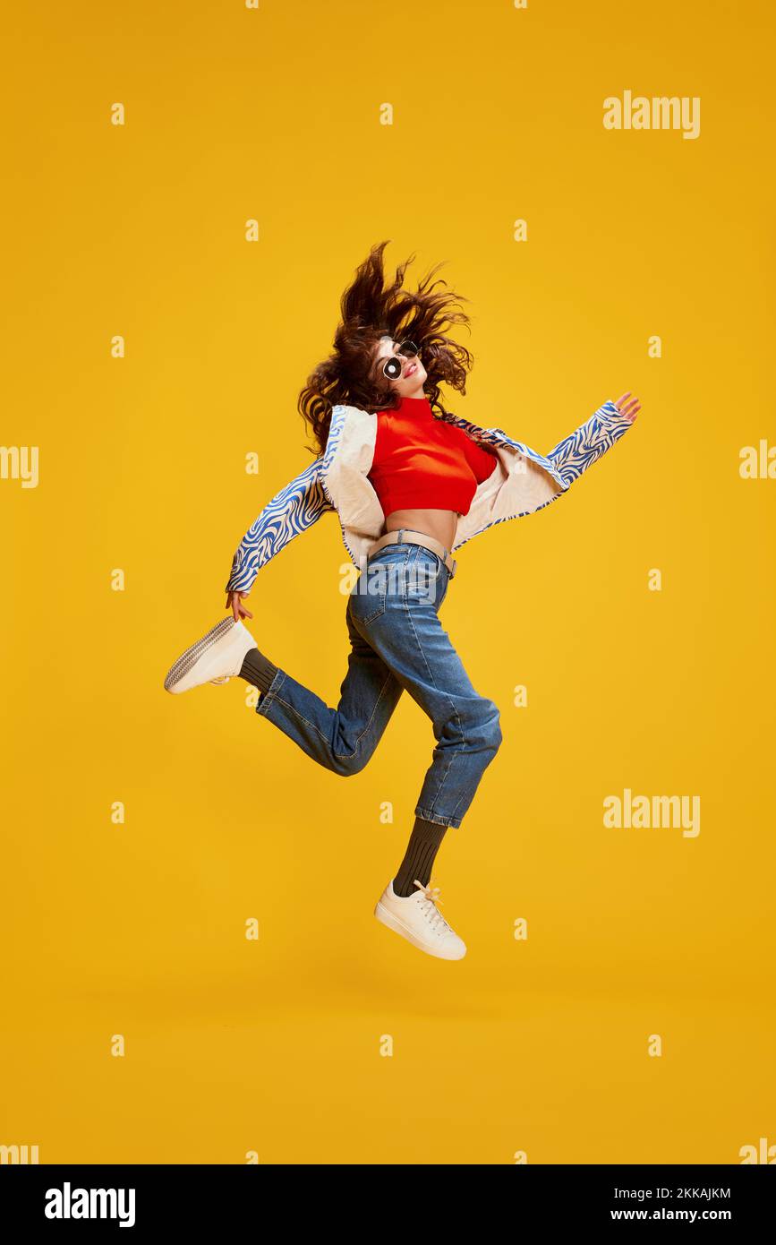 Portrait of young beautiful girl posing in stylish casual clothes ...