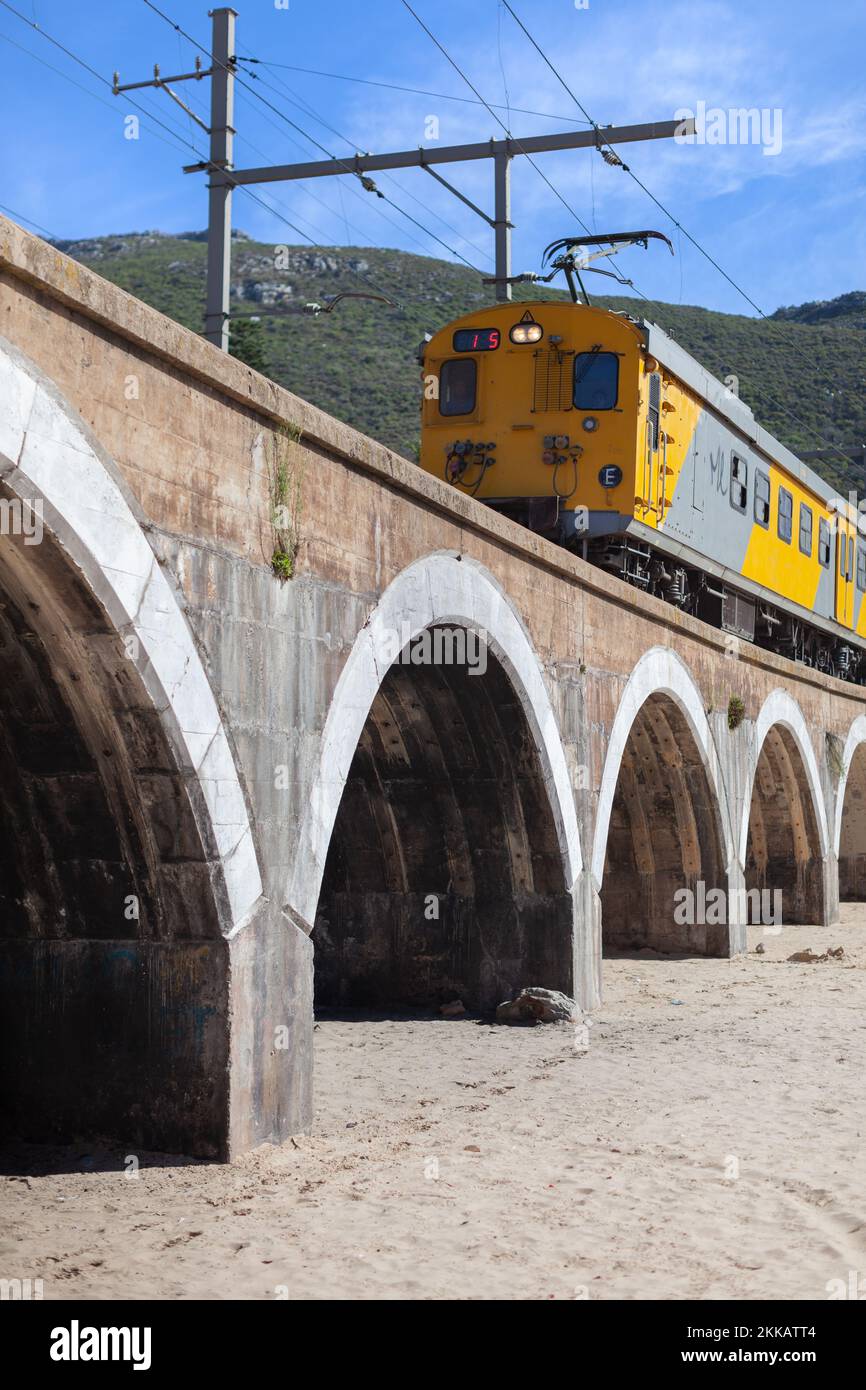 Train on bridge with Mountain in background in Kalk Bay Cape Town South ...