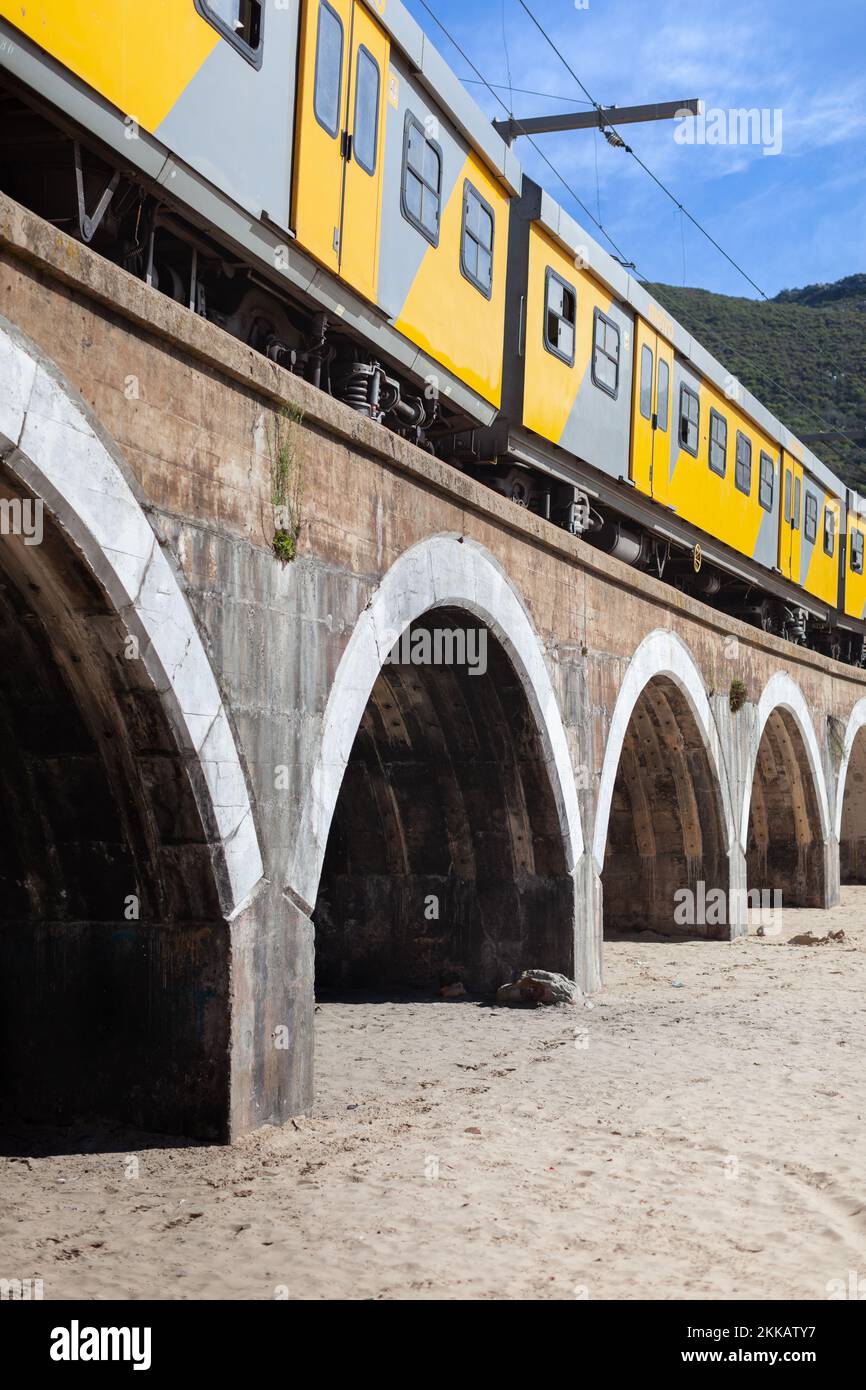 Train on bridge with Mountain in background in Kalk Bay Cape Town South ...